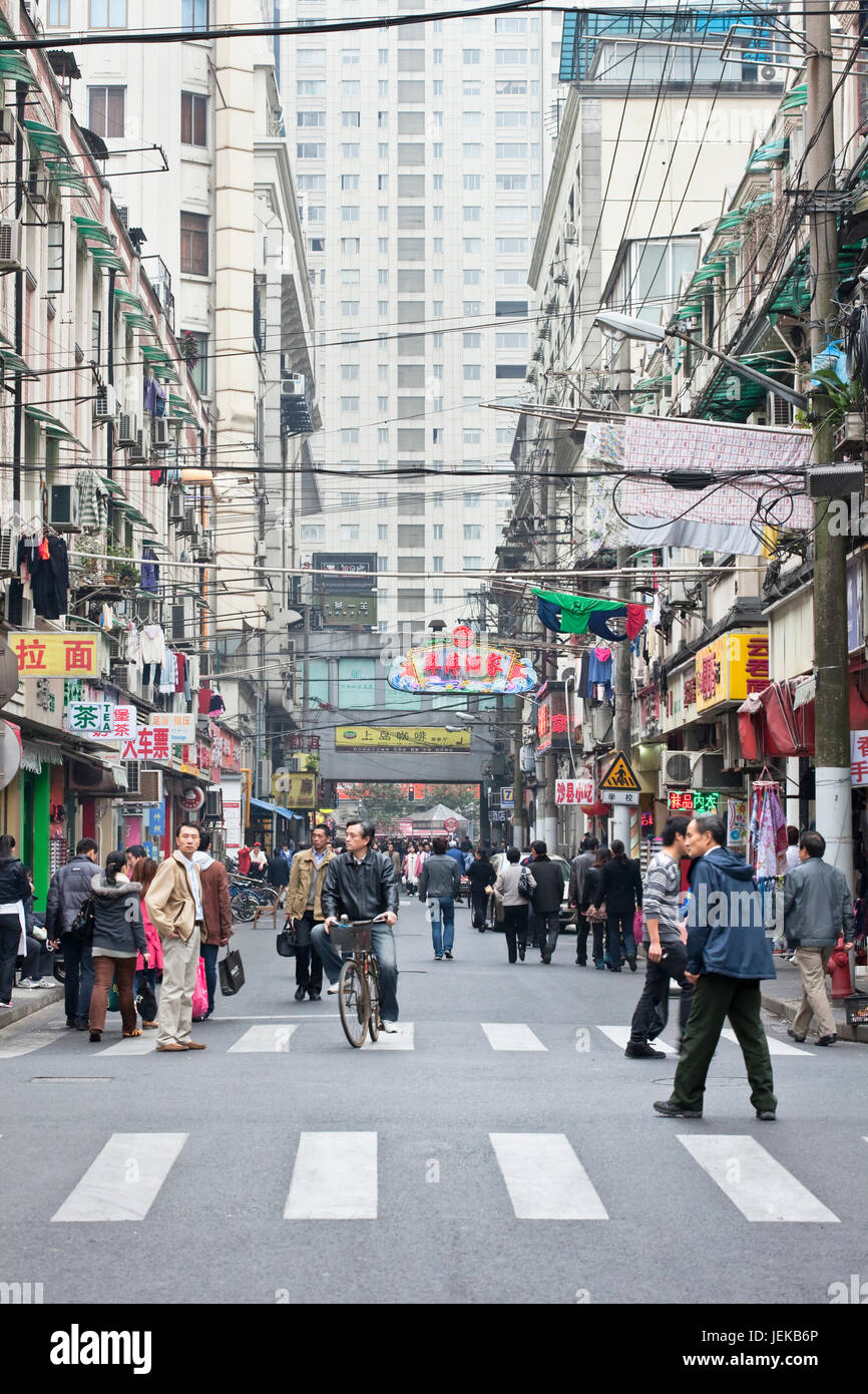 Narrow alley downtown Shanghai. With 23 million citizens Shanghai is ...