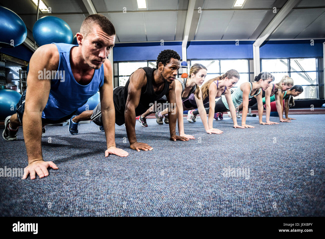 Fit people working out in fitness class Stock Photo - Alamy
