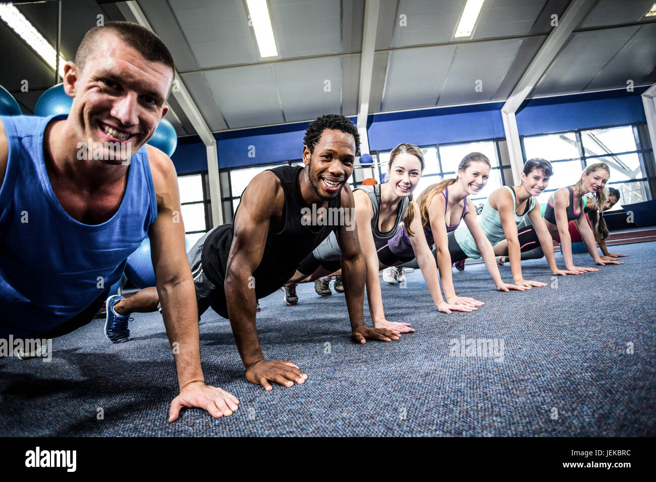 Fit people working out in fitness class Stock Photo - Alamy