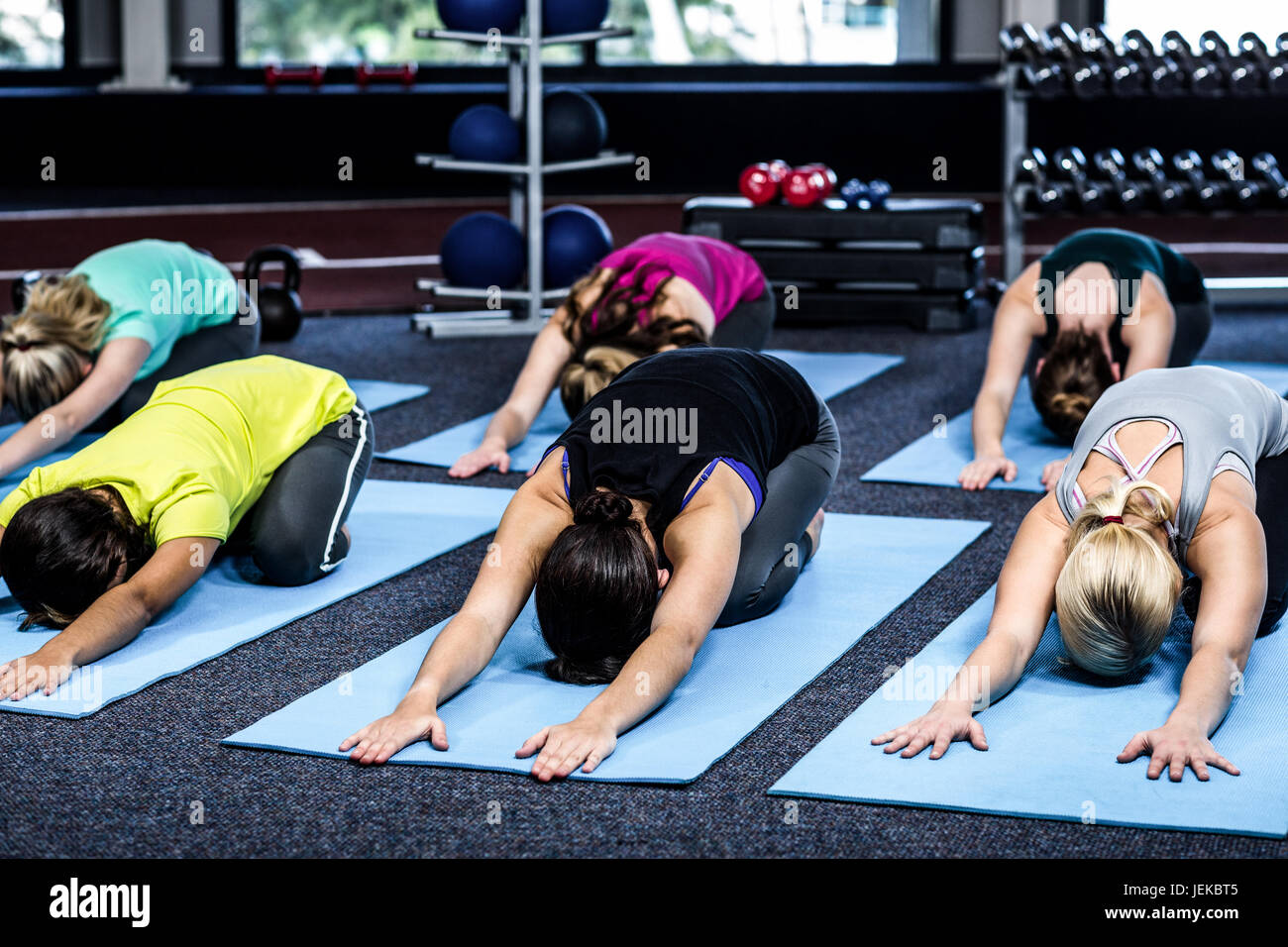Fitness class doing yoga exercises Stock Photo - Alamy
