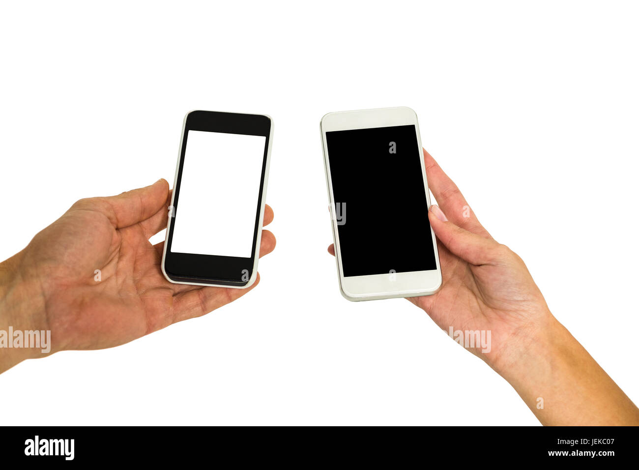 Cropped hands holding smartphones Stock Photo - Alamy