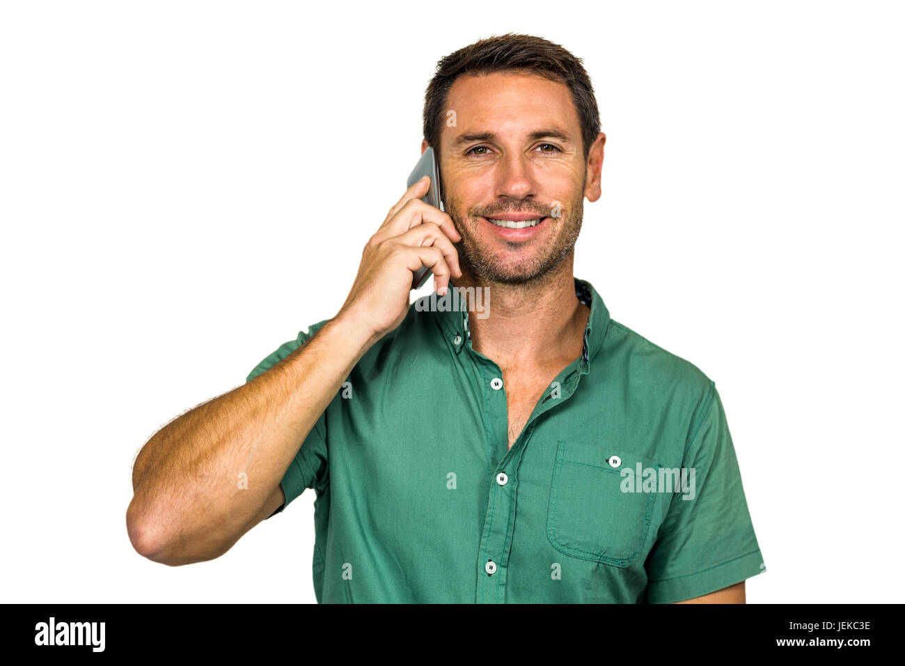 Man on phone call smiling at camera Stock Photo - Alamy