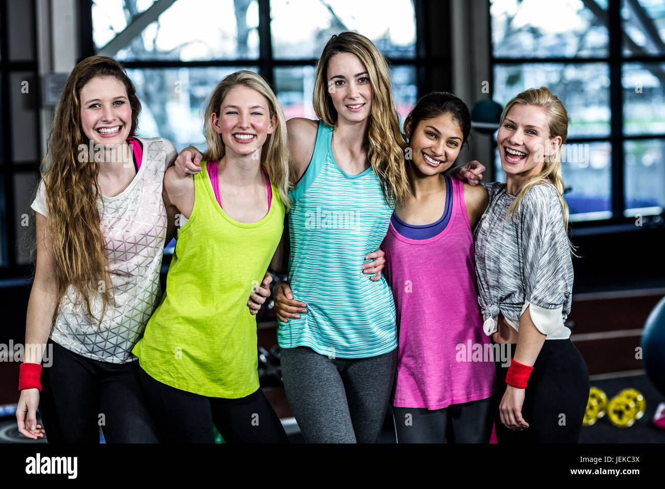 Fit group posing and smiling Stock Photo - Alamy