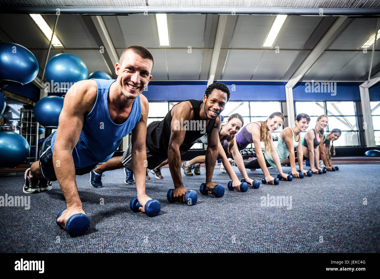 Fit people working out in fitness class Stock Photo - Alamy