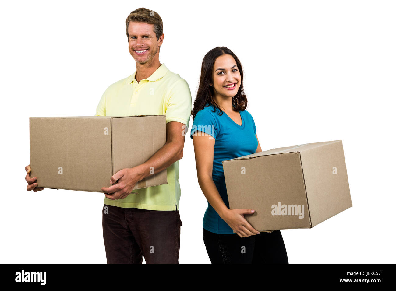 Couple holding boxes against white background Stock Photo - Alamy
