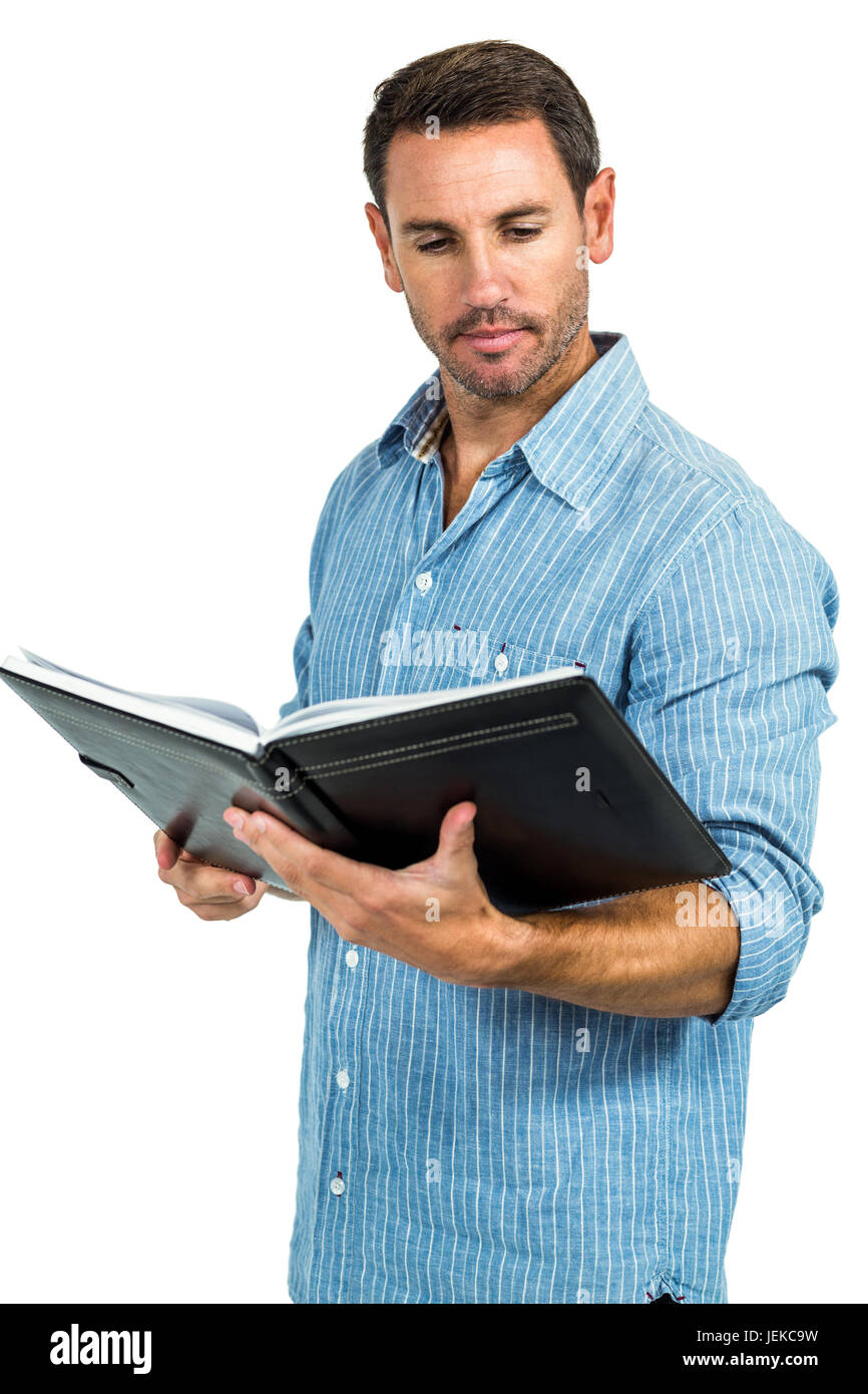 Handsome man reading book Stock Photo - Alamy