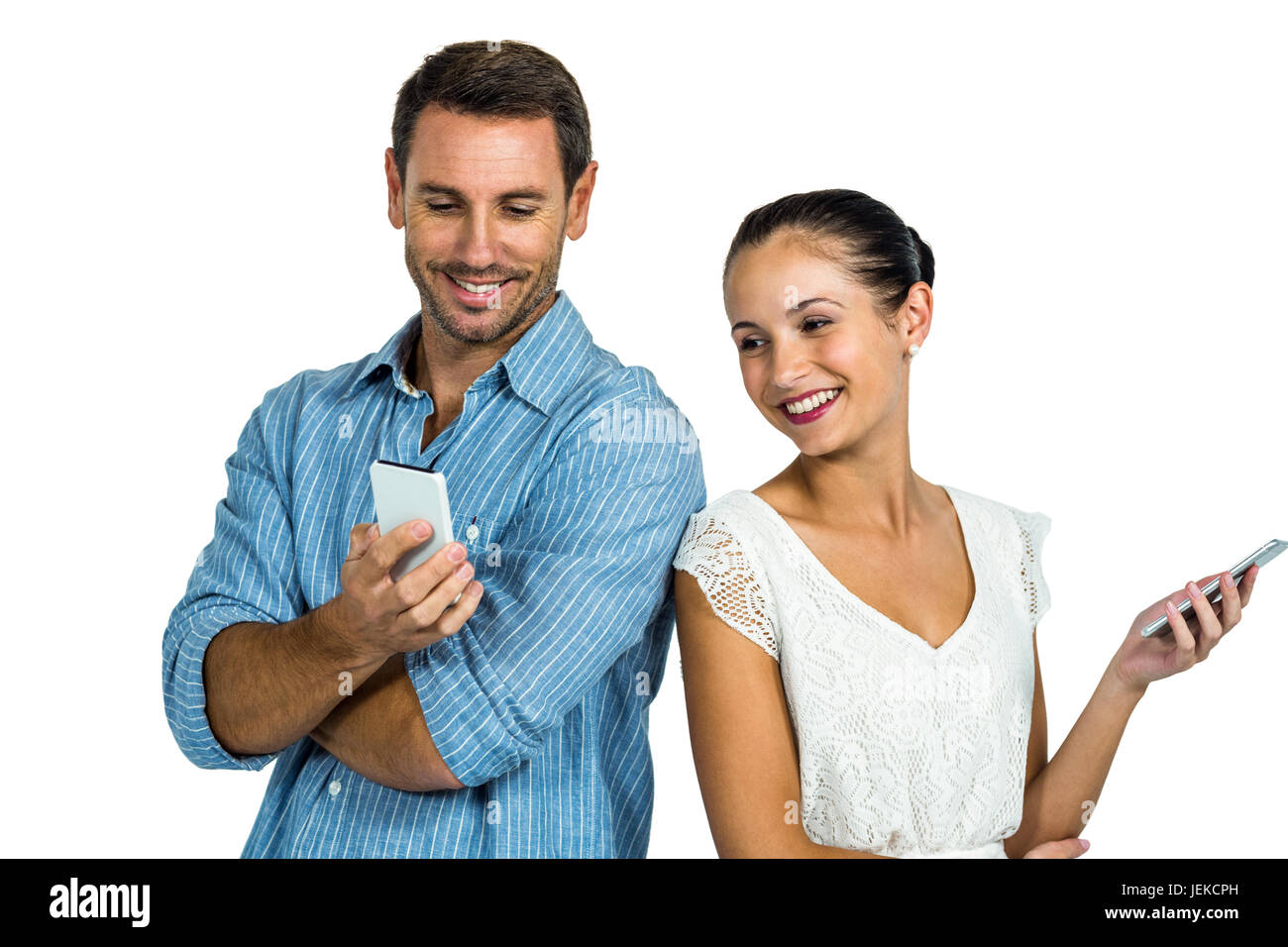 Happy couple using smartphones Stock Photo - Alamy