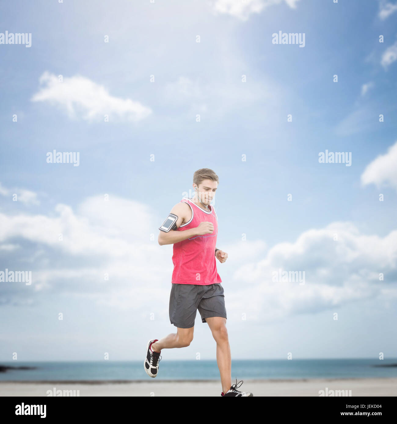 Young man running into waves hi-res stock photography and images - Alamy