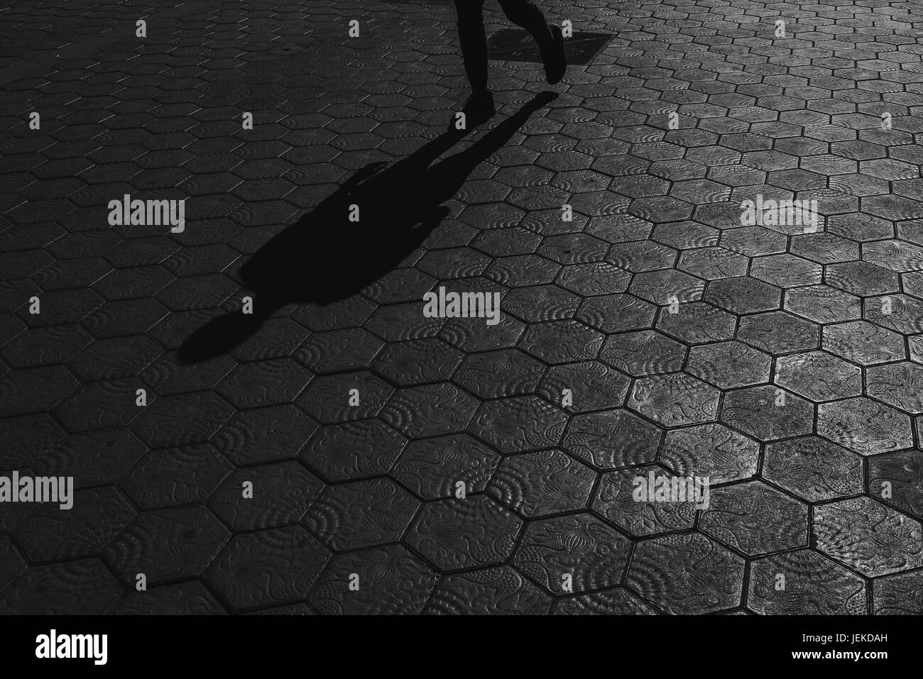 Man walking on paving hi-res stock photography and images - Alamy