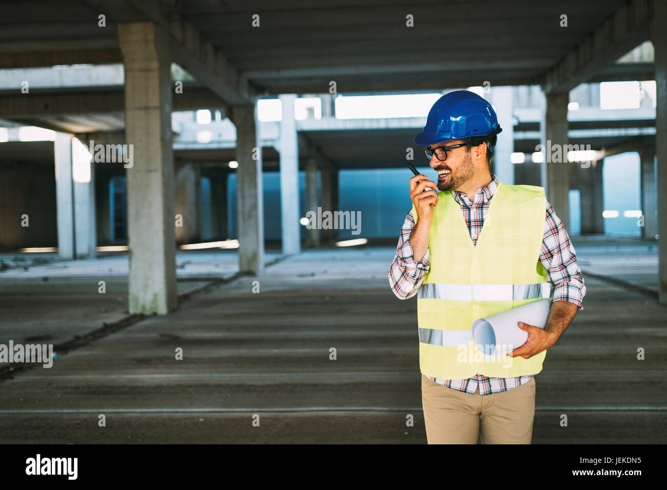 Picture of construction site engineer looking at construction plan ...