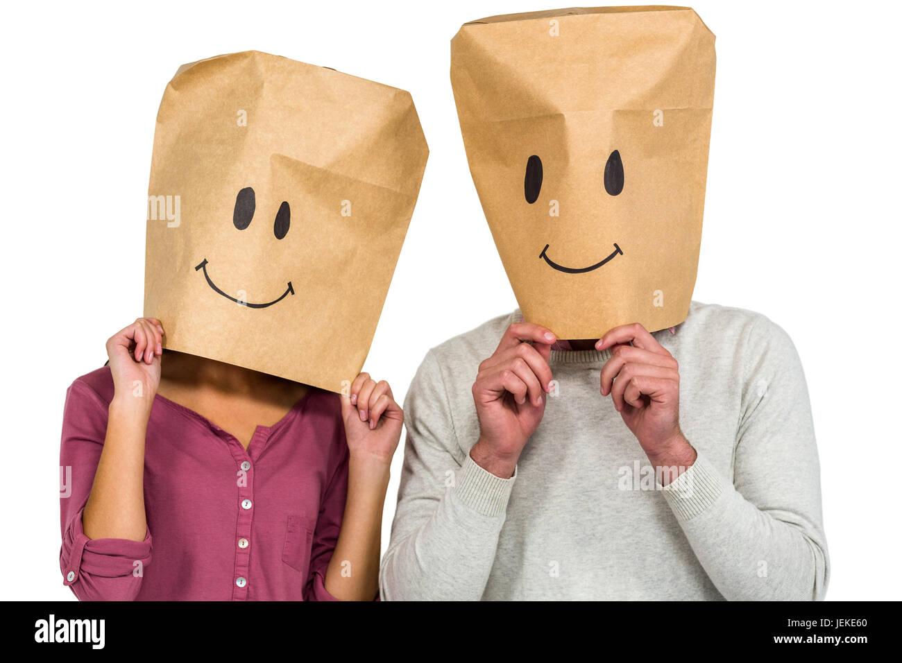 Couple covering their faces with paper bag Stock Photo - Alamy