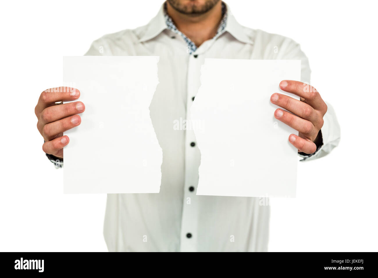 Standing man showing torn papers Stock Photo - Alamy