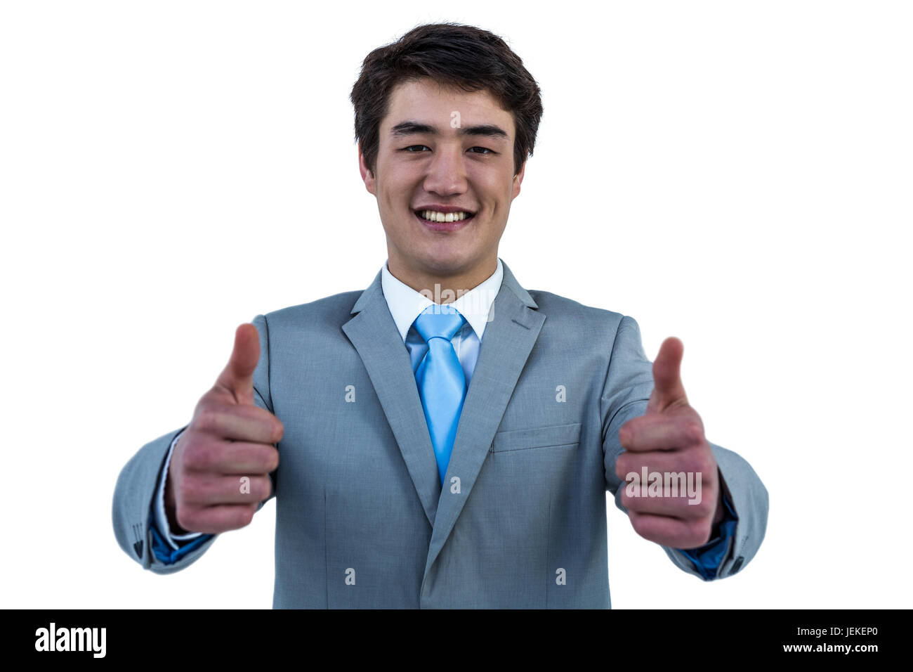 Smiling asian businessman showing thumbs up Stock Photo - Alamy