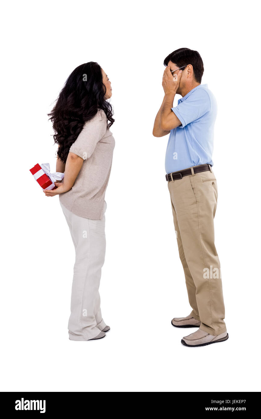 Smiling man covering eyes Cut Out Stock Images & Pictures - Alamy