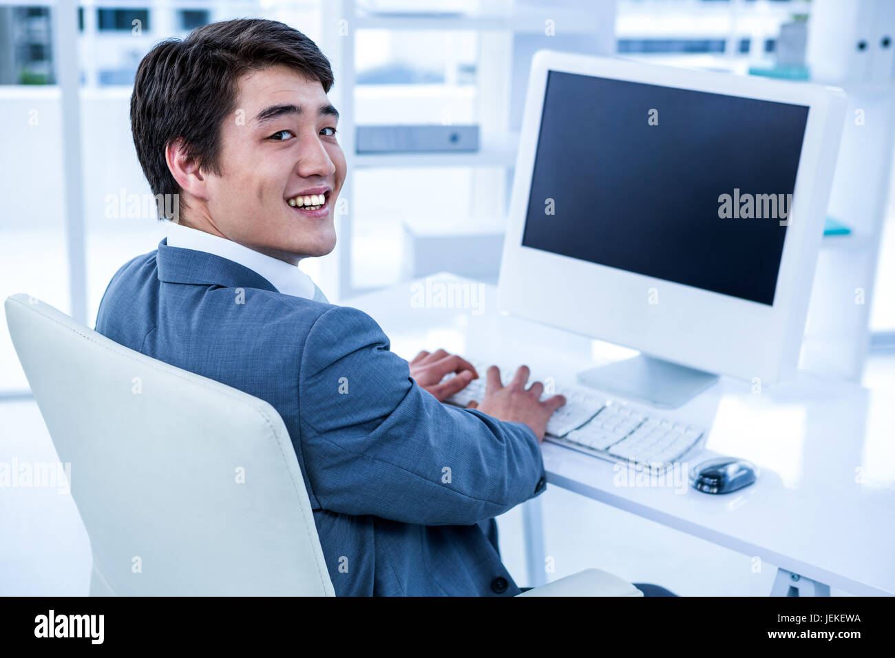 Smiling asian boy using hi-res stock photography and images - Alamy