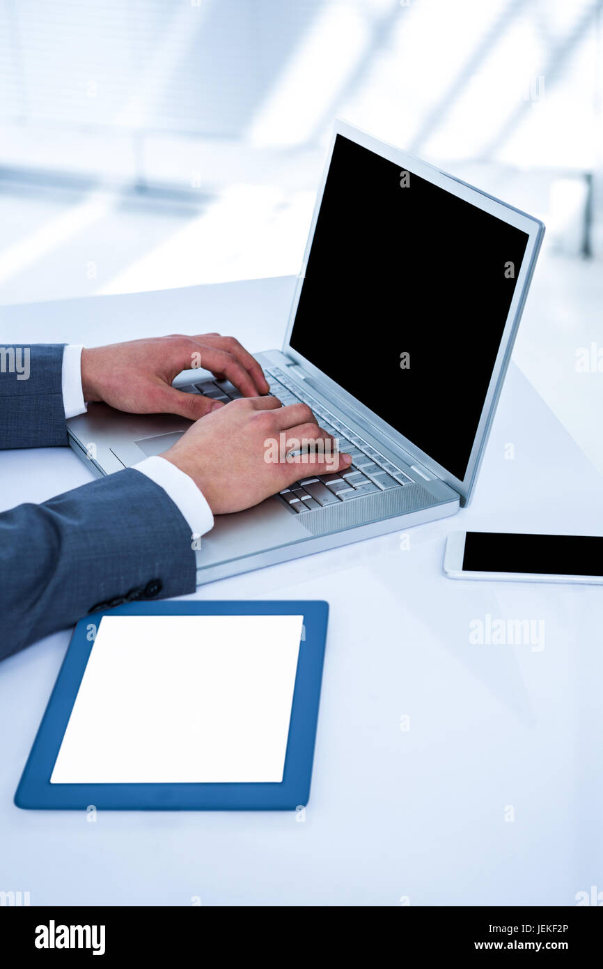 Businessman using his computer Stock Photo - Alamy