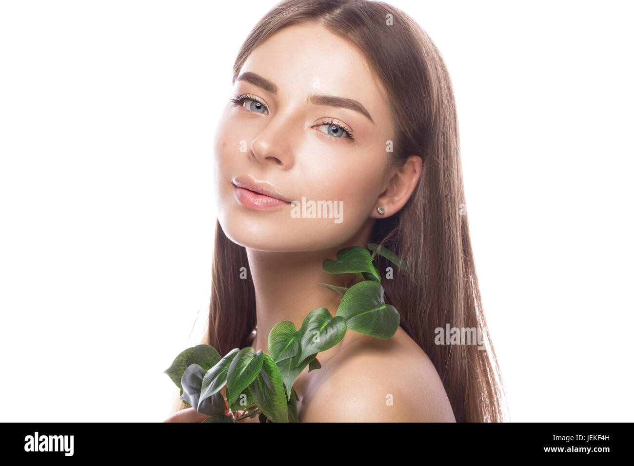 Beautiful young girl with a light natural make-up and perfect skin with ...