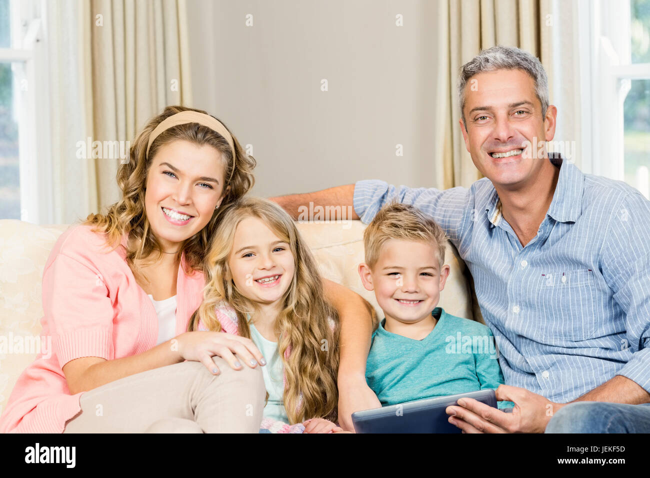 Family lounge tablet hi-res stock photography and images - Alamy