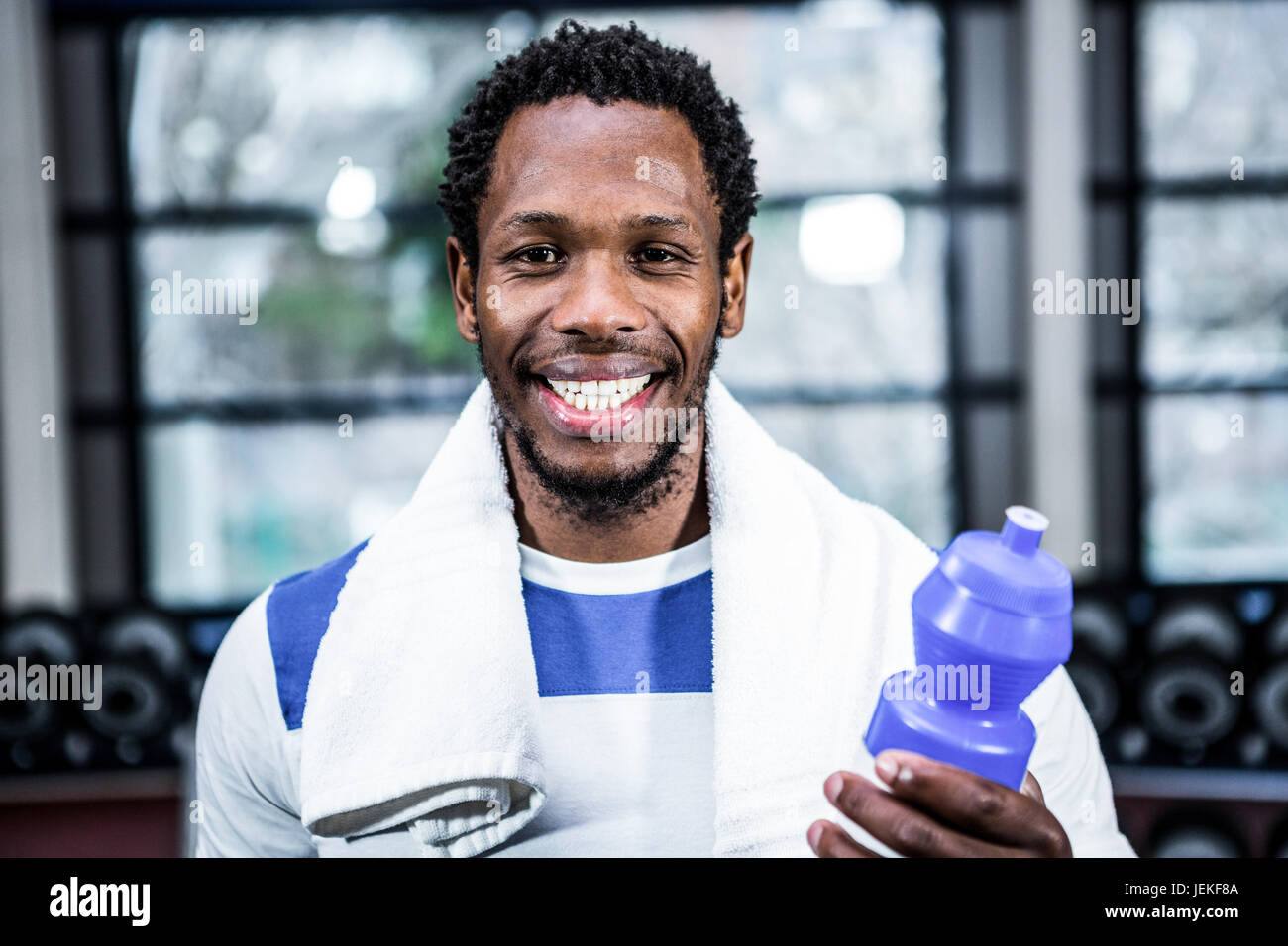 Smiling muscular man posing Stock Photo - Alamy