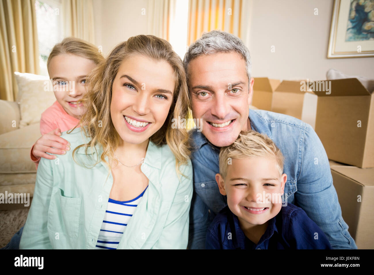 Happy family smiling Stock Photo - Alamy
