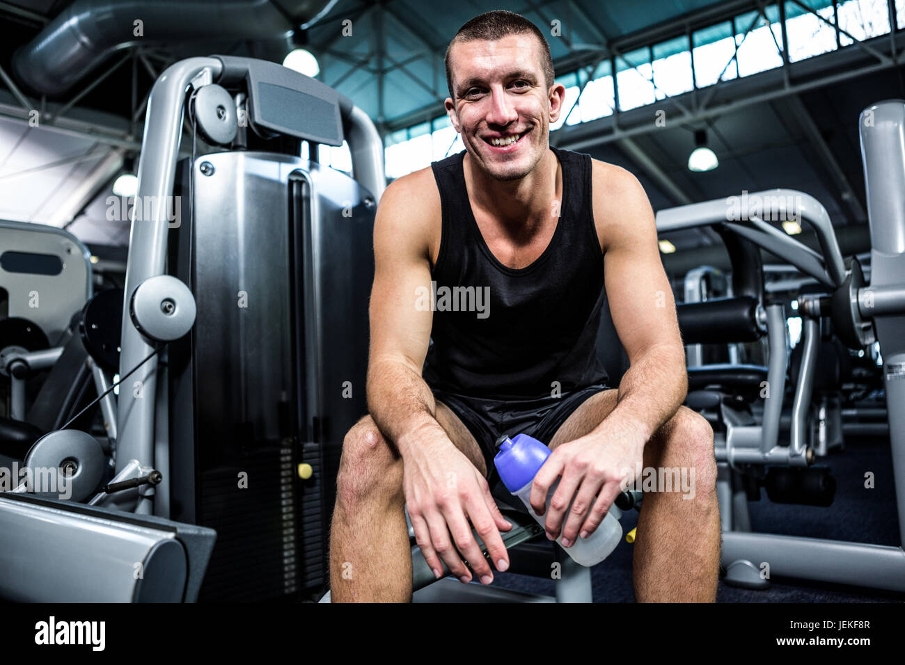 Muscular man smiling at camera Stock Photo - Alamy