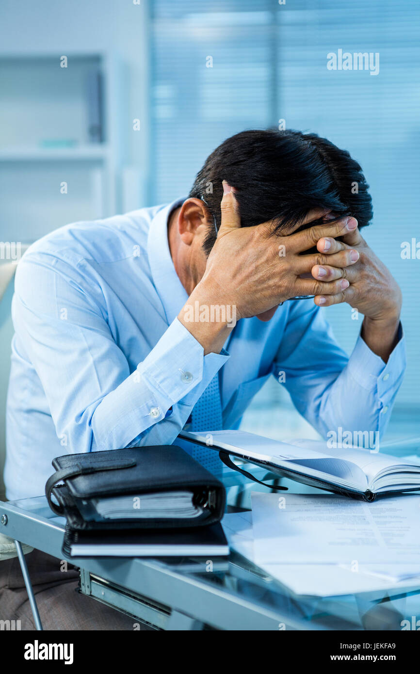 Worried businessman documents office hi-res stock photography and ...