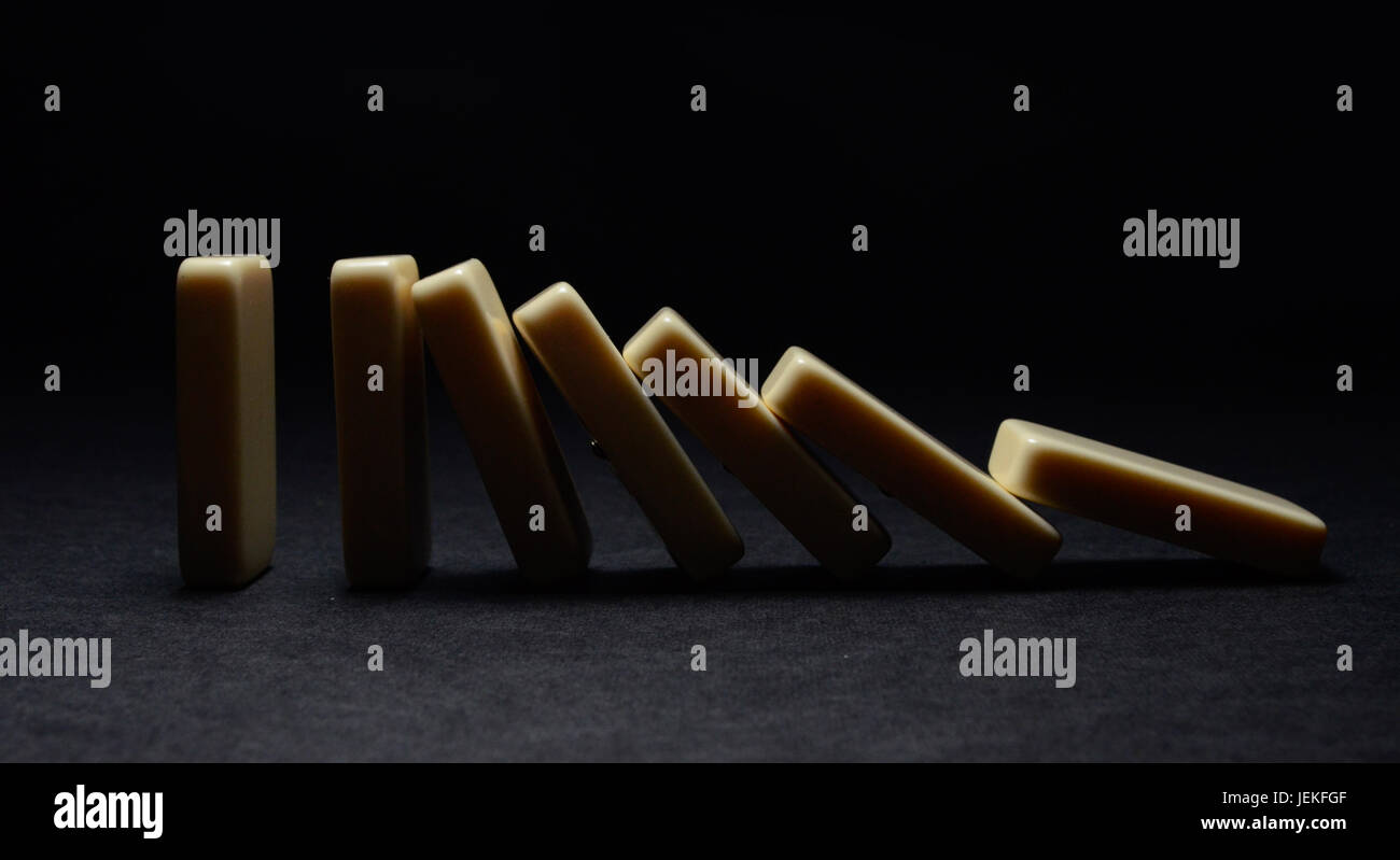 domino pieces falling Stock Photo - Alamy