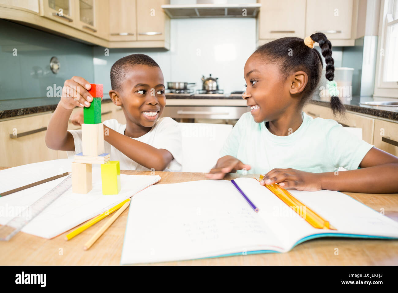 Boy and girl homework kitchen table hi-res stock photography and images ...