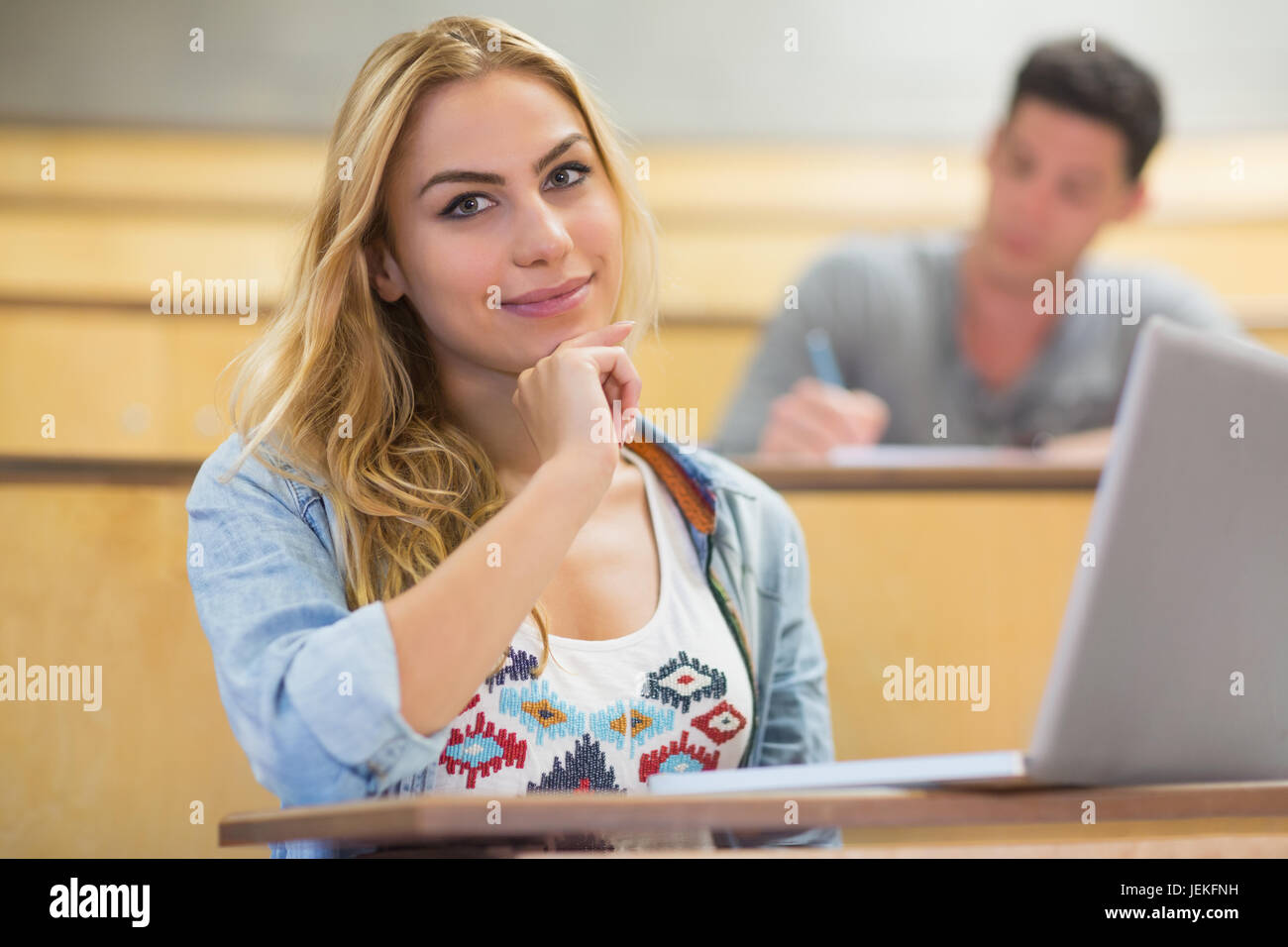 Smiling female student during class Stock Photo - Alamy