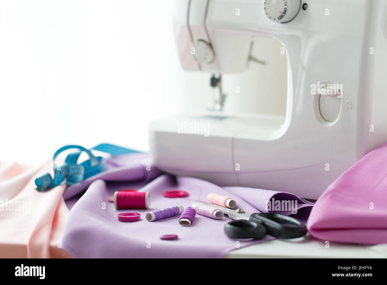 sewing machine, scissors, buttons and fabric Stock Photo - Alamy