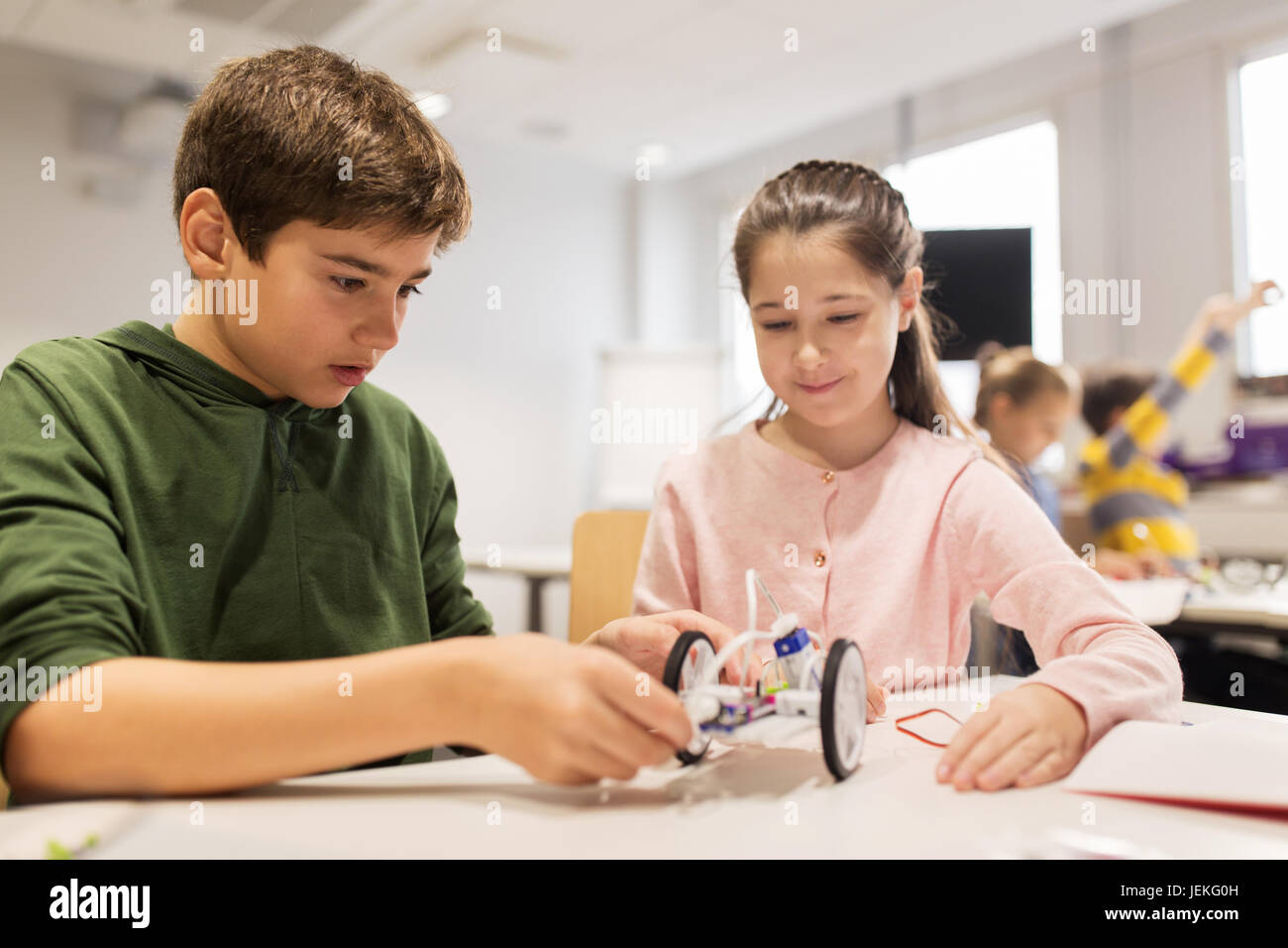 happy children building robots at robotics school Stock Photo - Alamy
