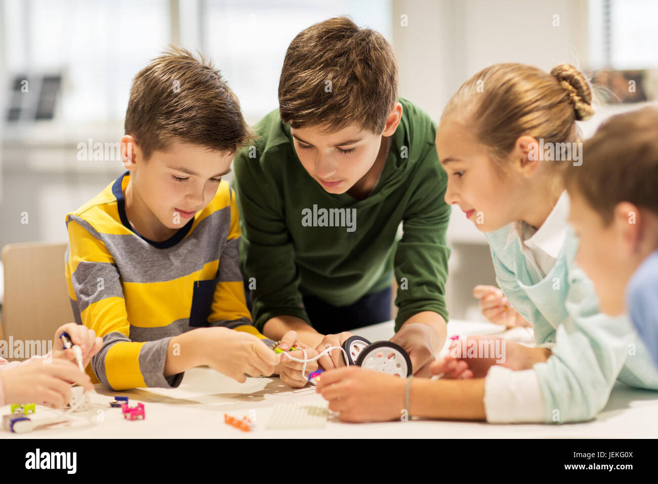happy children building robots at robotics school Stock Photo - Alamy