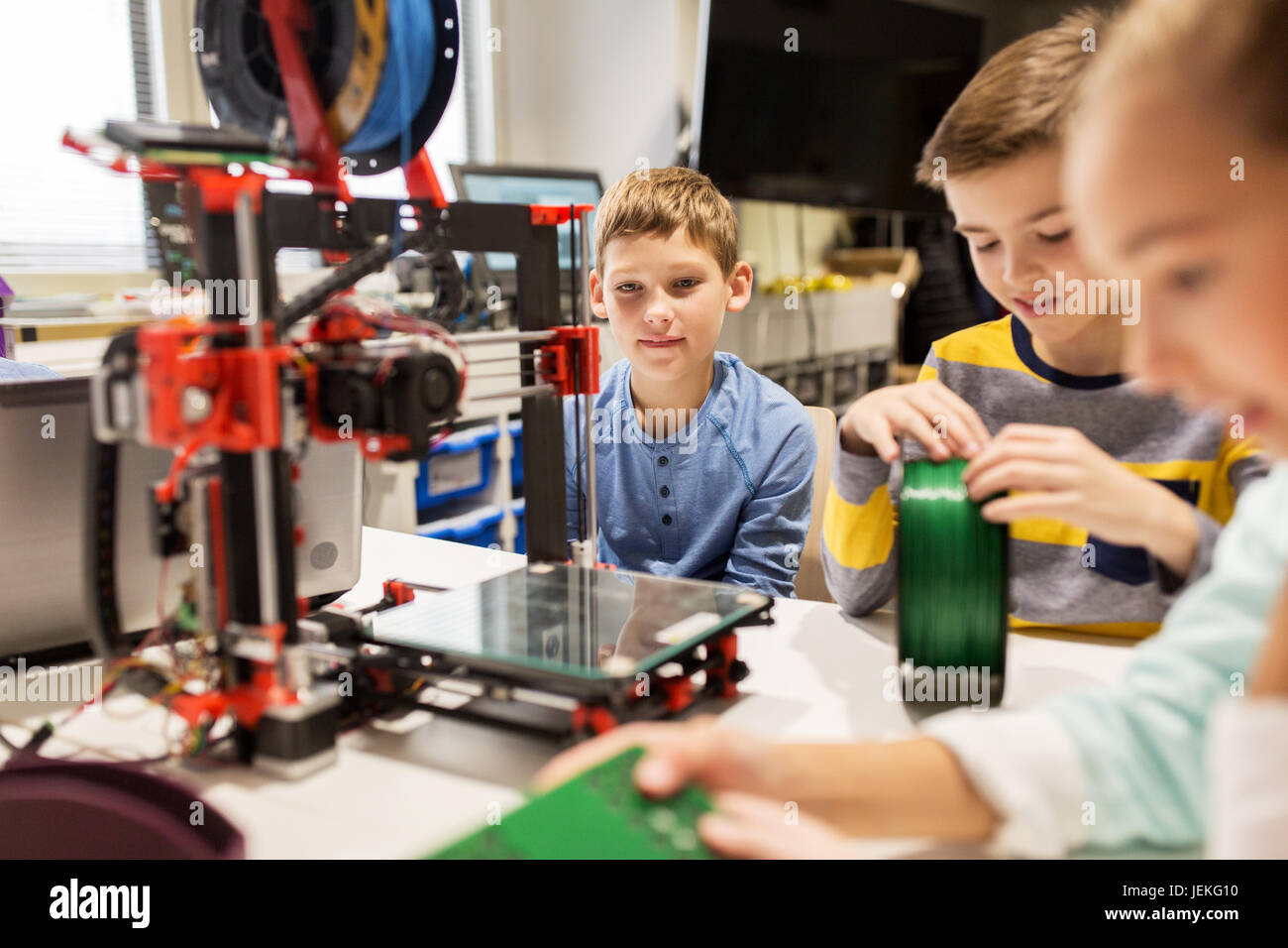 happy children with 3d printer at robotics school Stock Photo - Alamy