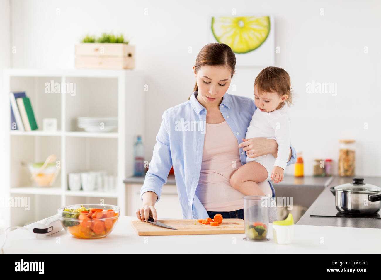 happy mother and baby cooking food at home kitchen Stock Photo - Alamy