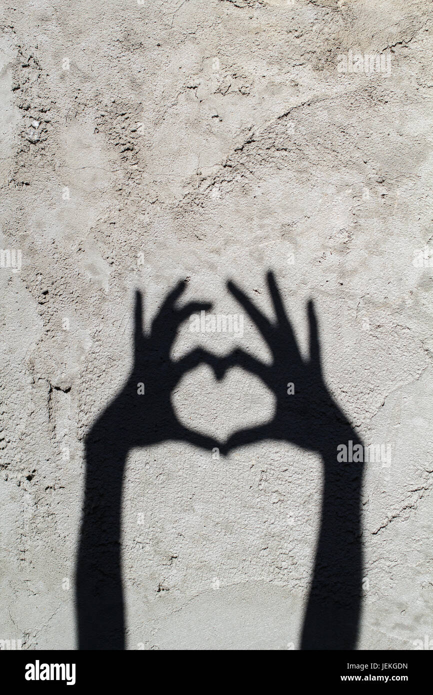 Shadow persons hands making hi-res stock photography and images - Alamy