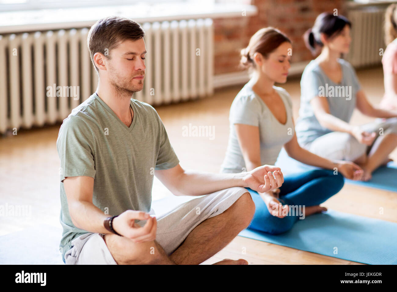 group of people making yoga exercises at studio Stock Photo - Alamy