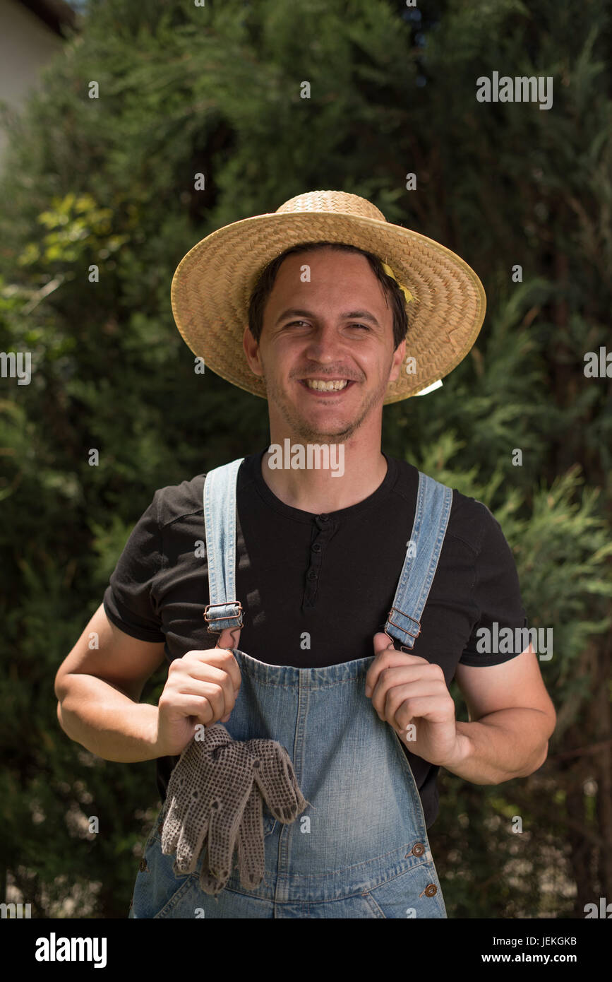 Portrait of a smiling gardener Stock Photo - Alamy