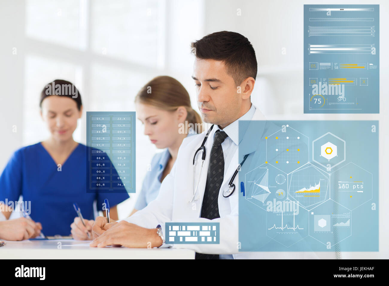 group of doctors at hospital writing Stock Photo - Alamy