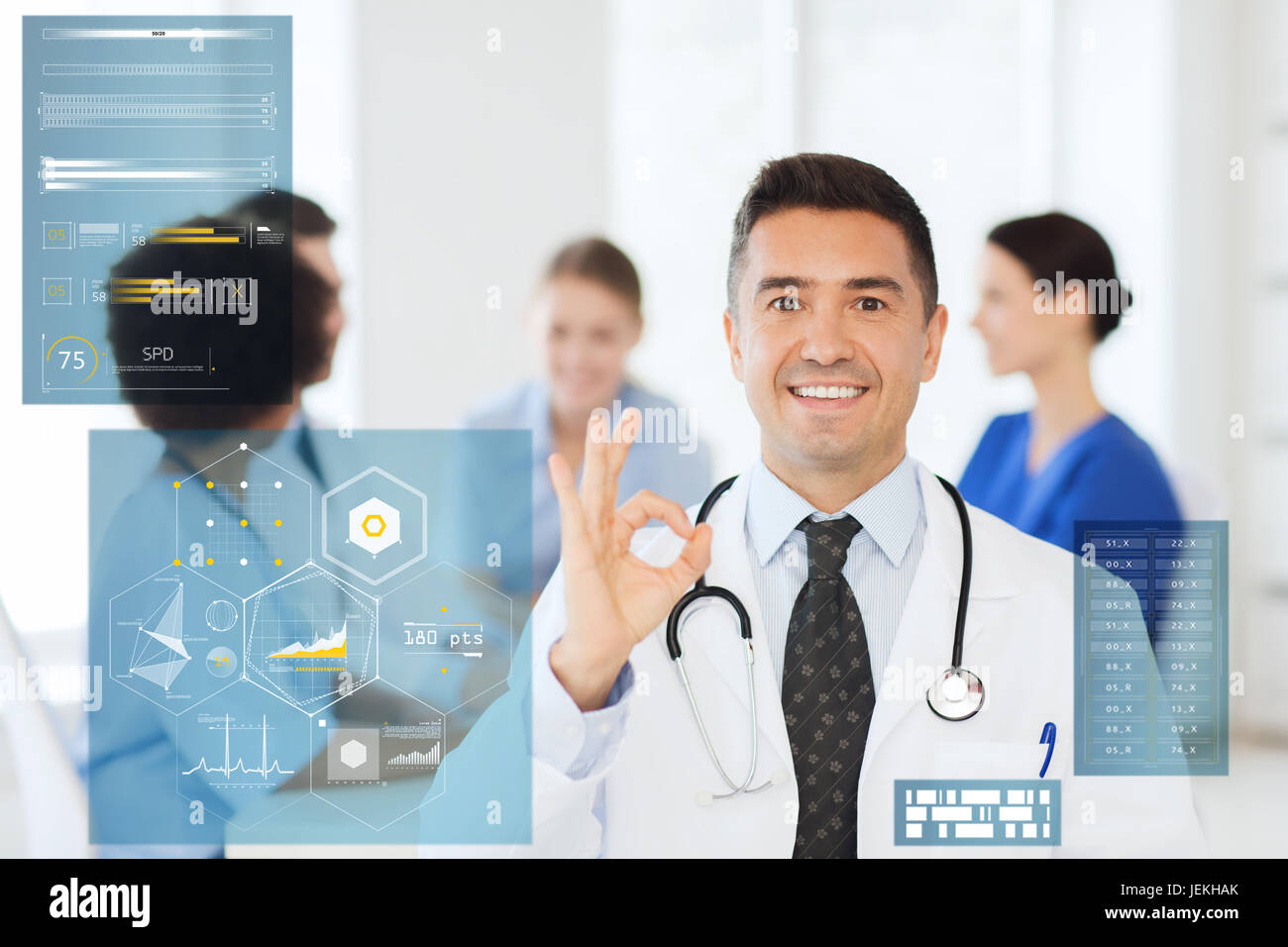 happy doctor showing ok hand sign at hospital Stock Photo - Alamy