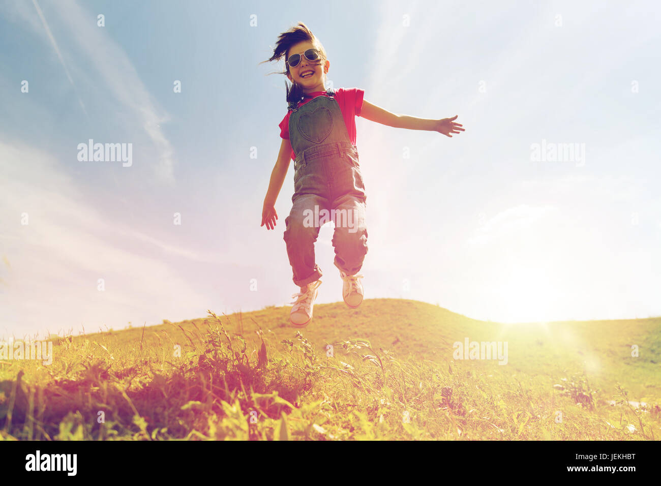 Girl jumping high hi-res stock photography and images - Alamy