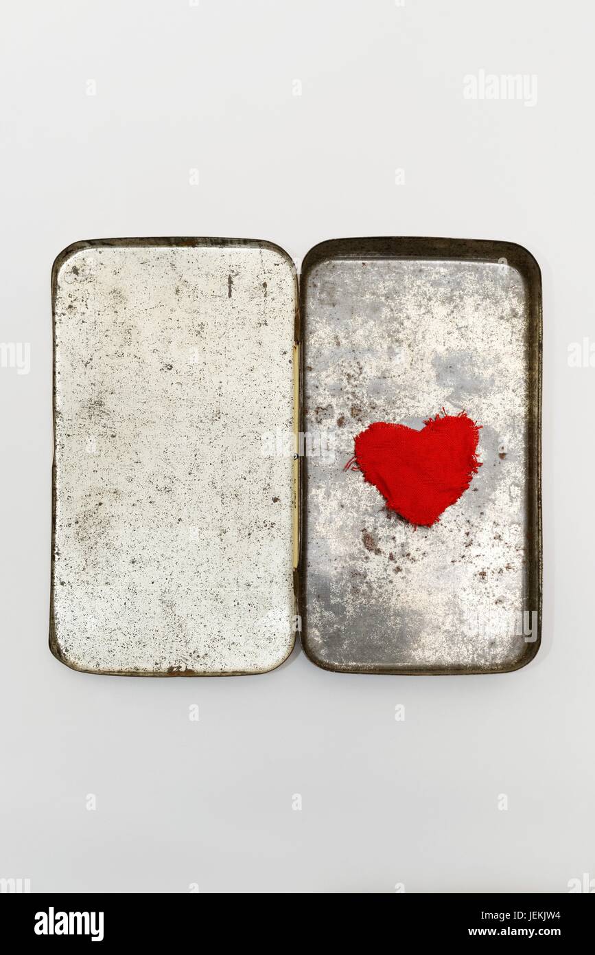 An old box made of metal with a red heart in it Stock Photo - Alamy