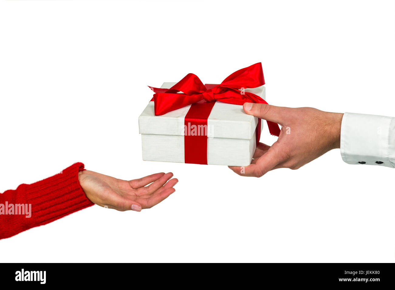 Cropped hand of man giving gift to woman Stock Photo - Alamy