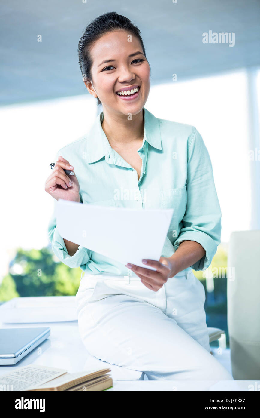 Smiling businesswoman sitting on swivel hi-res stock photography and ...