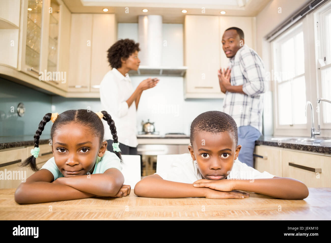 Sad siblings against parents arguing Stock Photo - Alamy
