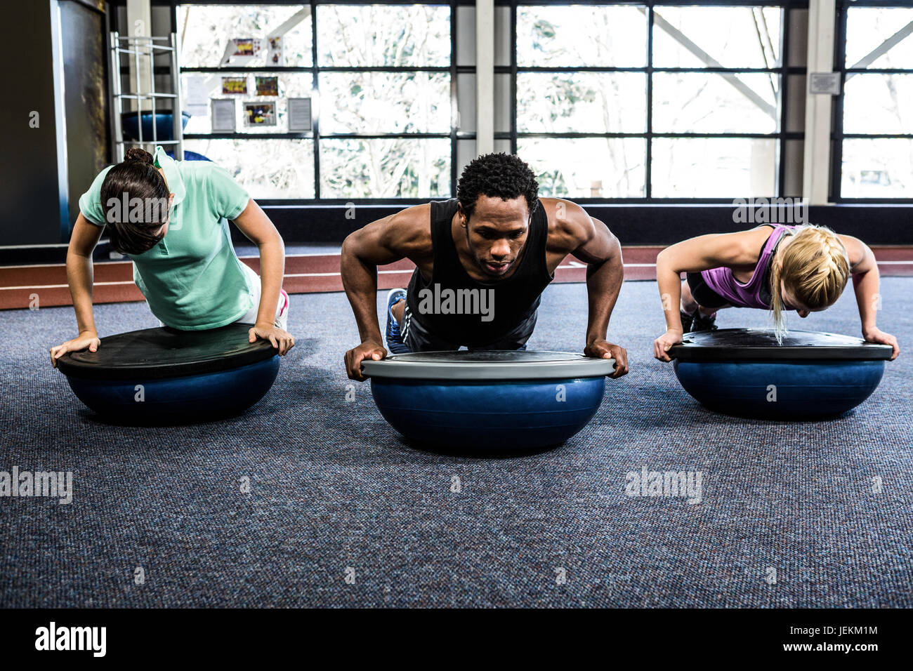 Fit people doing bosu push ups Stock Photo - Alamy