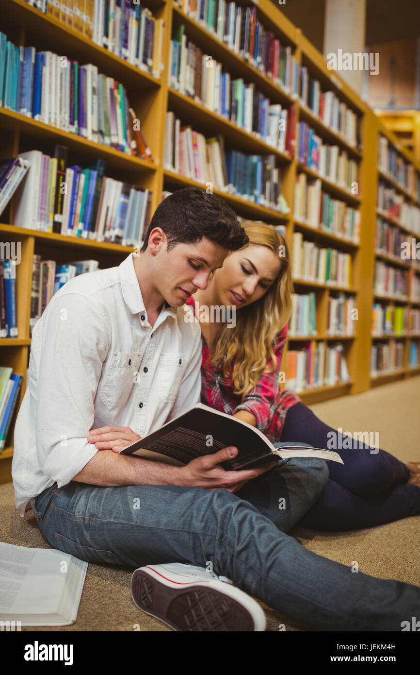 Smiling students working together on floor Stock Photo - Alamy