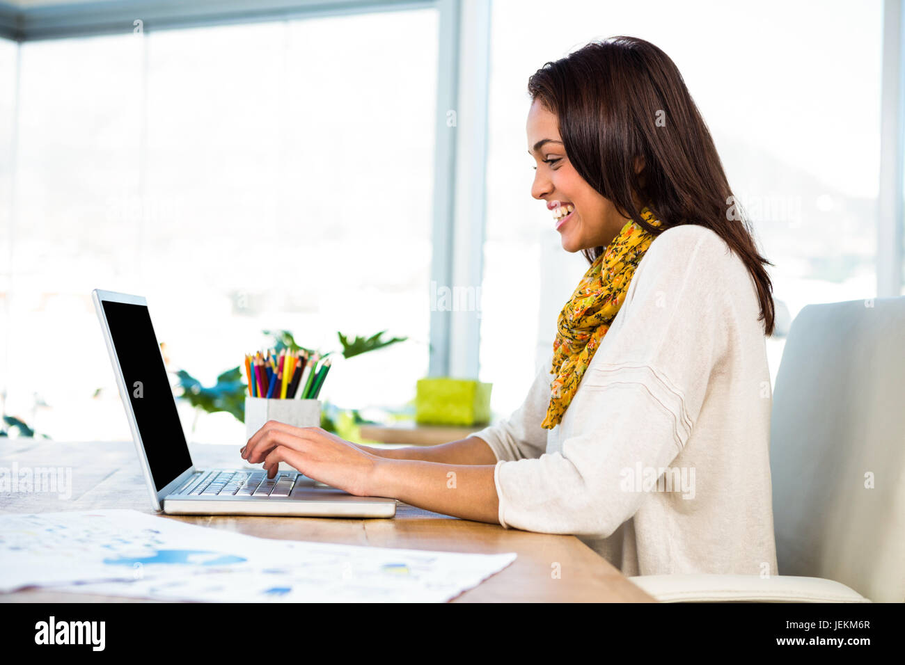 Young girl uses his computer Stock Photo - Alamy