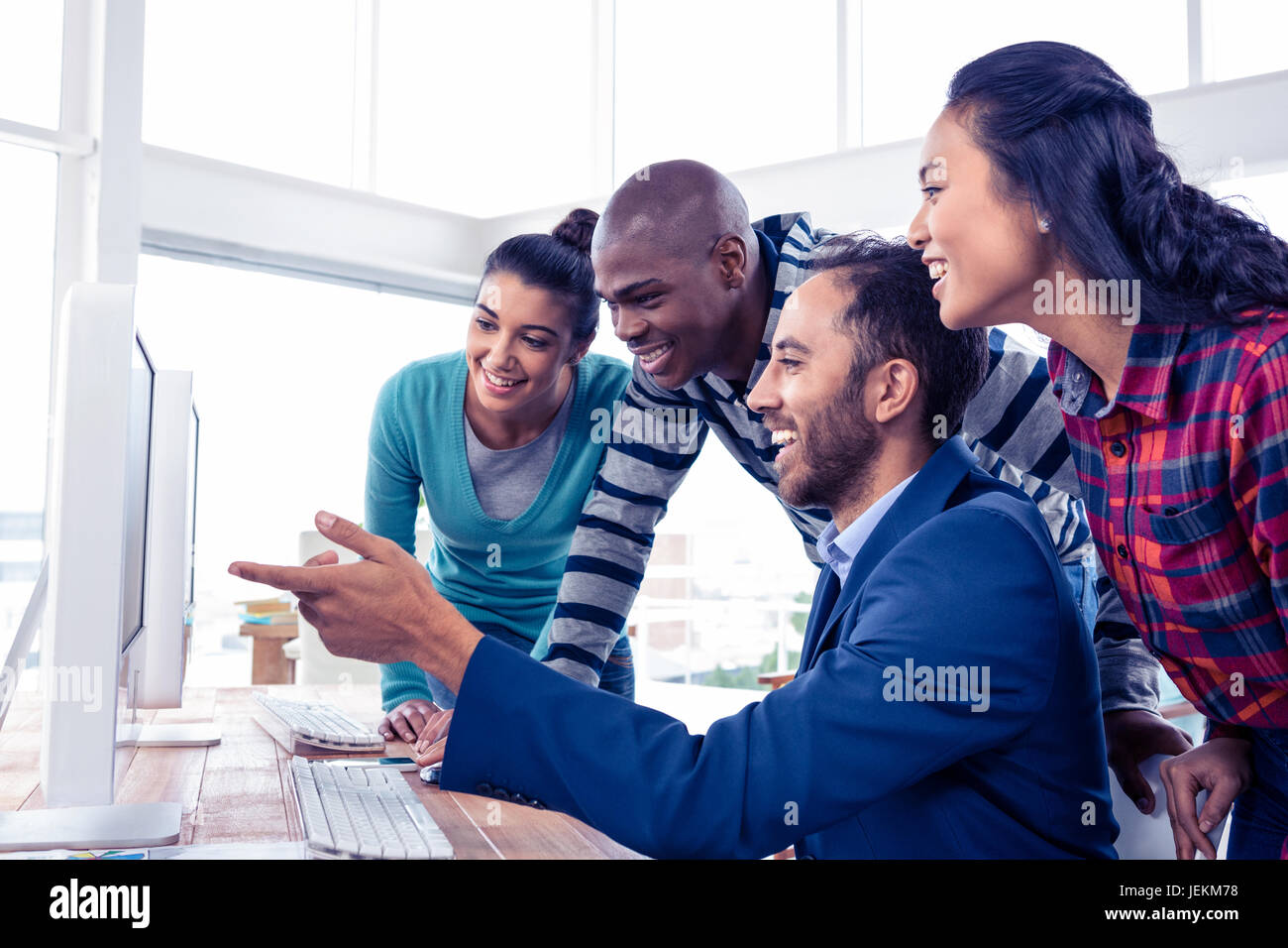 Cheerful businessman giving training to team Stock Photo - Alamy