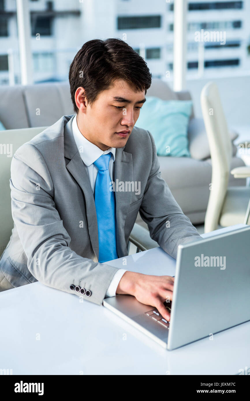 Concentrated businessman typing on computer Stock Photo - Alamy