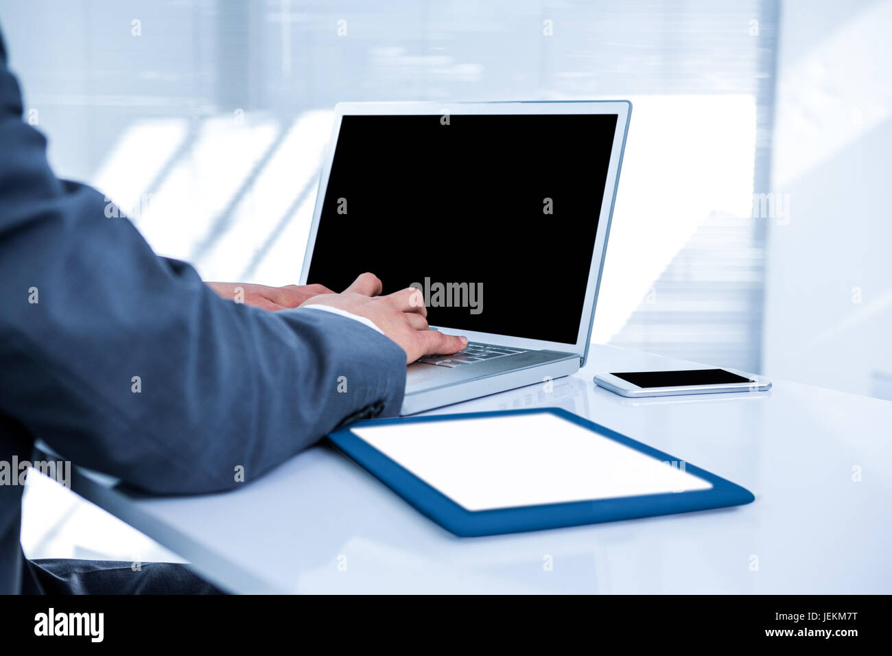 Businessman using his computer Stock Photo - Alamy